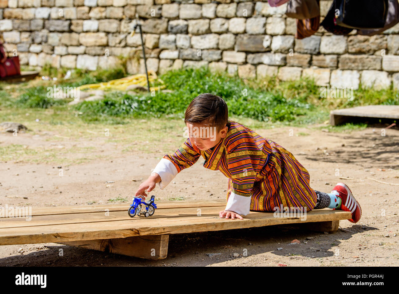 TRIMPHU, BHUTAN - MAR 8, 2017: Unidentified Ngalops little boy plays ...