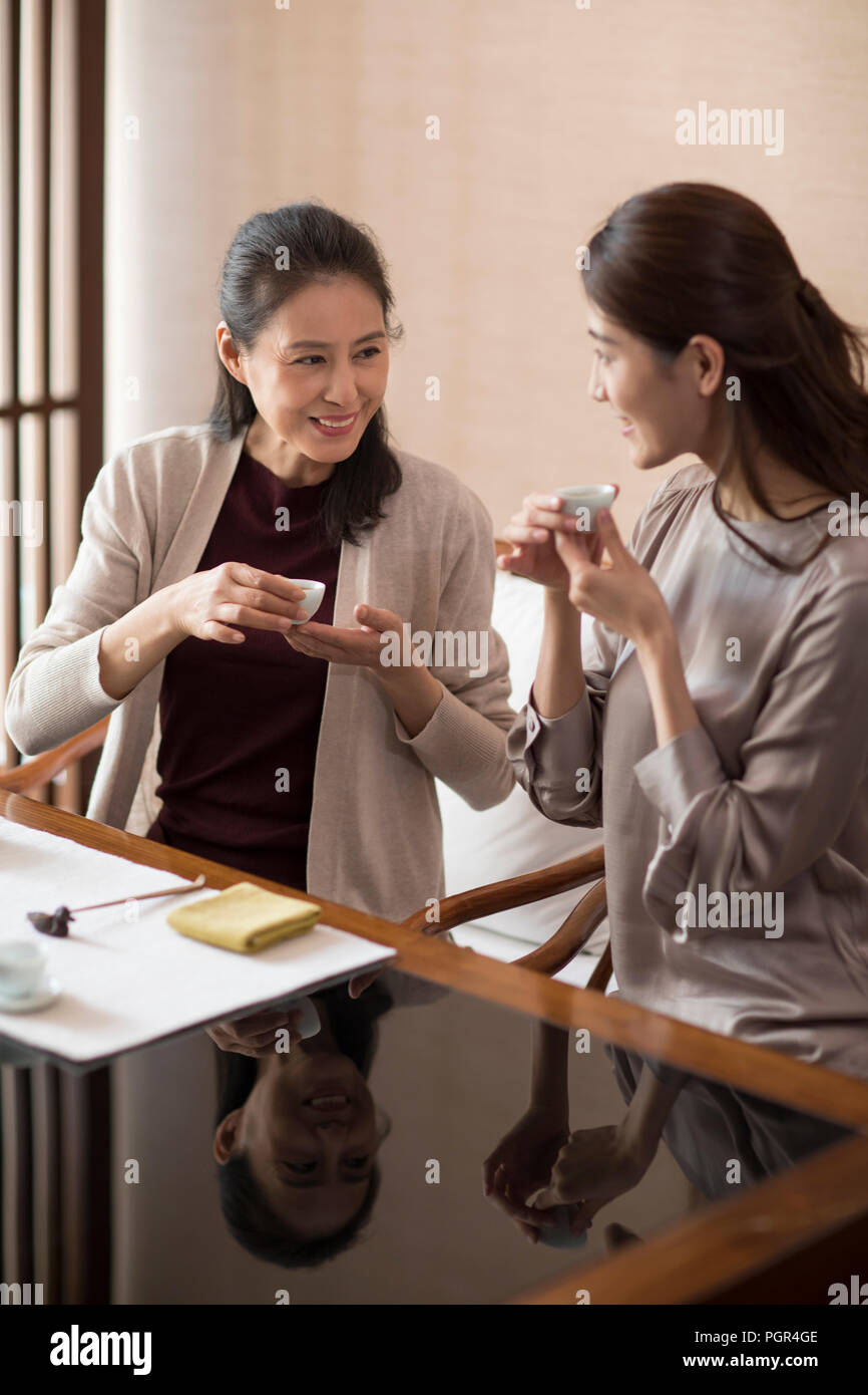 Elegance women drinking tea Stock Photo - Alamy