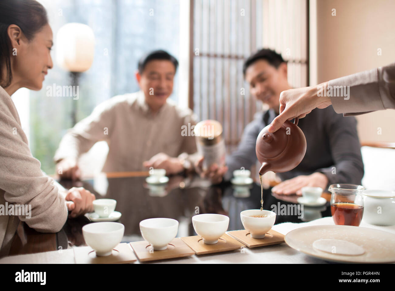 Young woman performing tea ceremony Stock Photo - Alamy