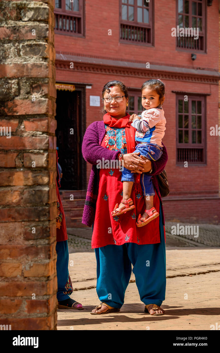 KATMANDU, NEPAL - MAR 6, 2017: Unidentified Chhetri woman holds a baby ...