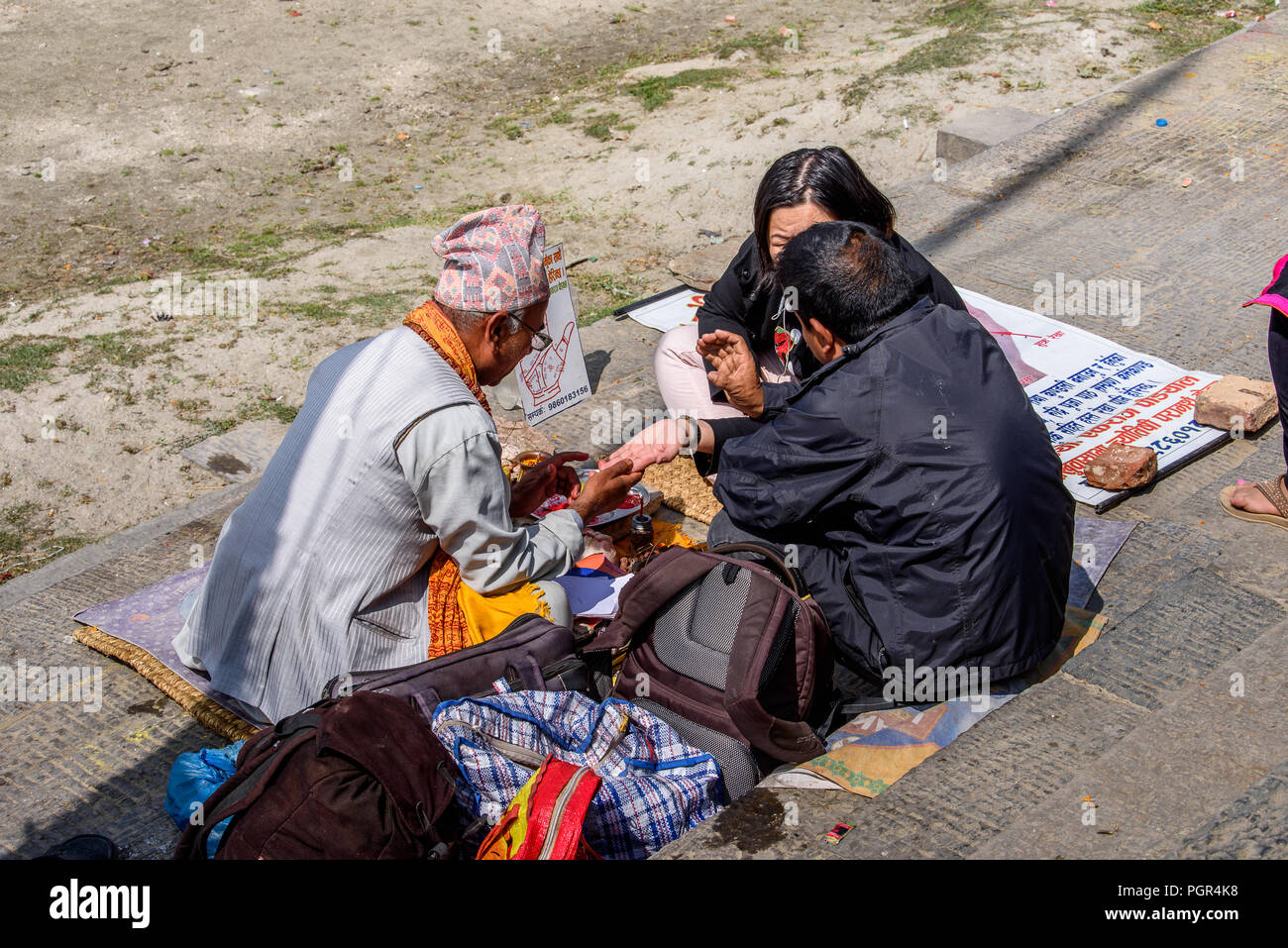 KATMANDU, NEPAL - MAR 6, 2017: Unidentified Chhetri people sit on the ...