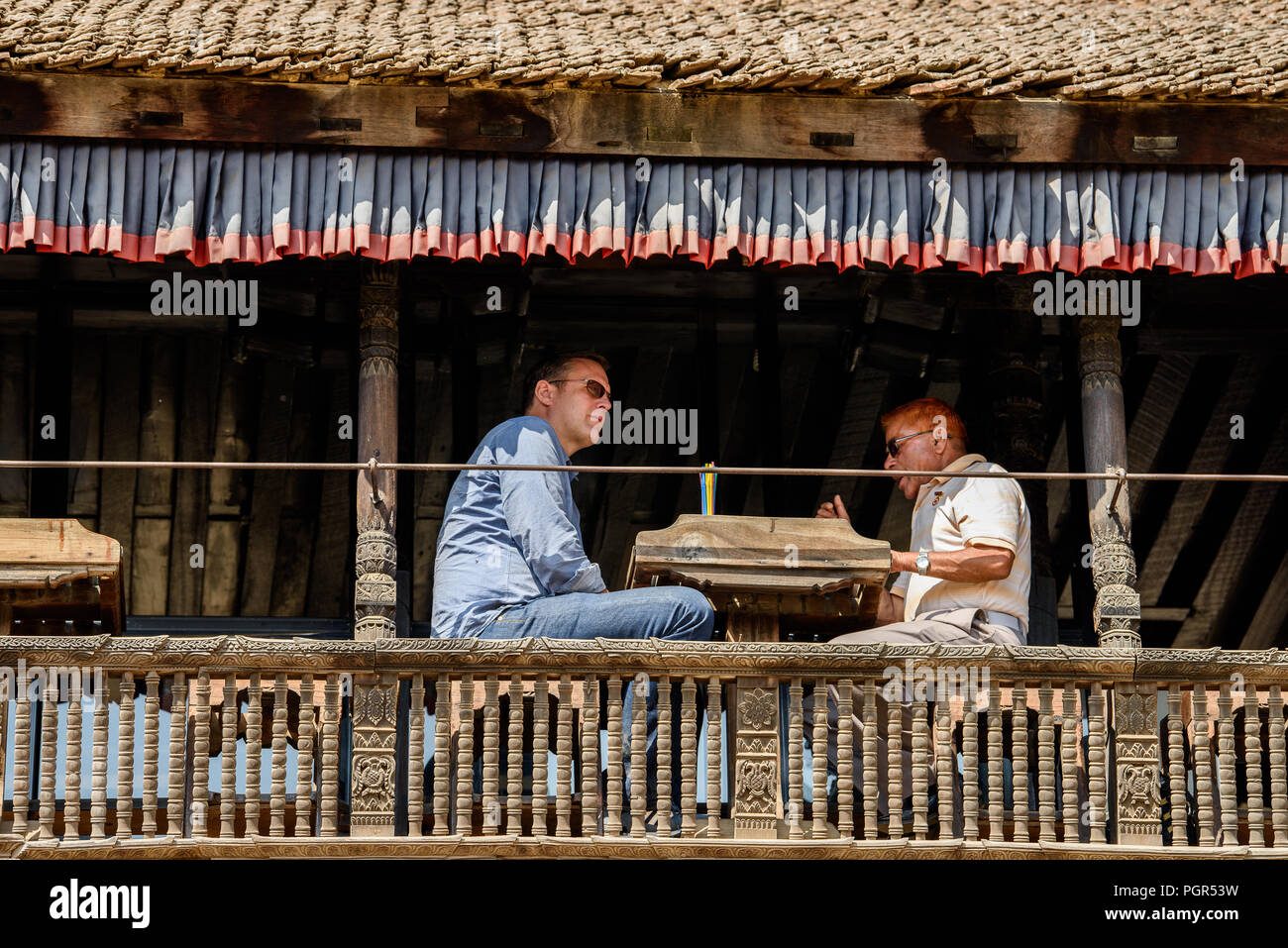 KATMANDU, NEPAL - MAR 6, 2017: Unidentified Chhetri men sit by the ...