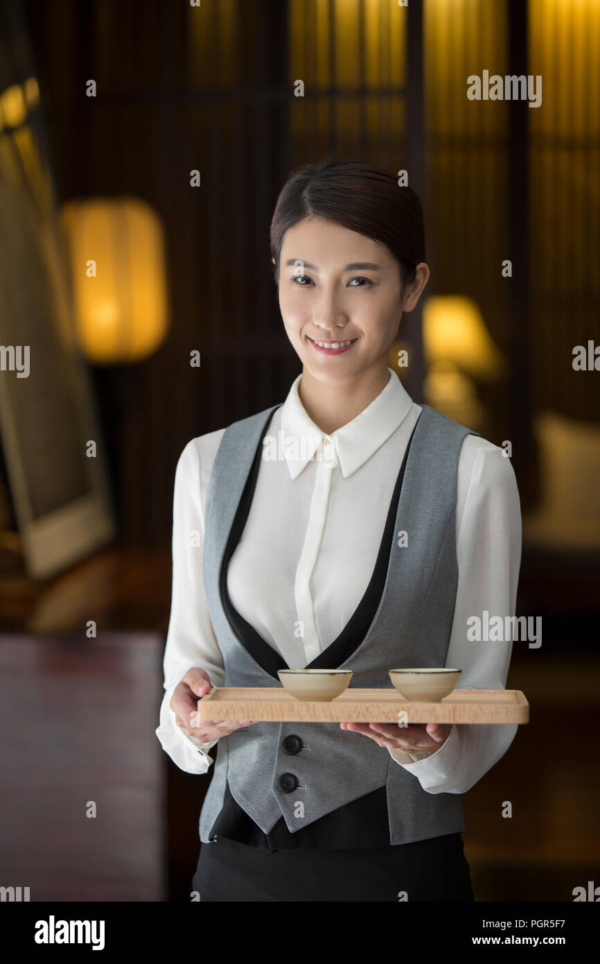 Tea house waitress standing hi-res stock photography and images - Alamy