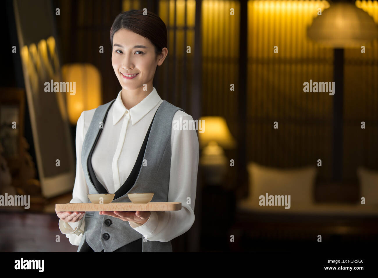 Tea house waitress standing hi-res stock photography and images - Alamy