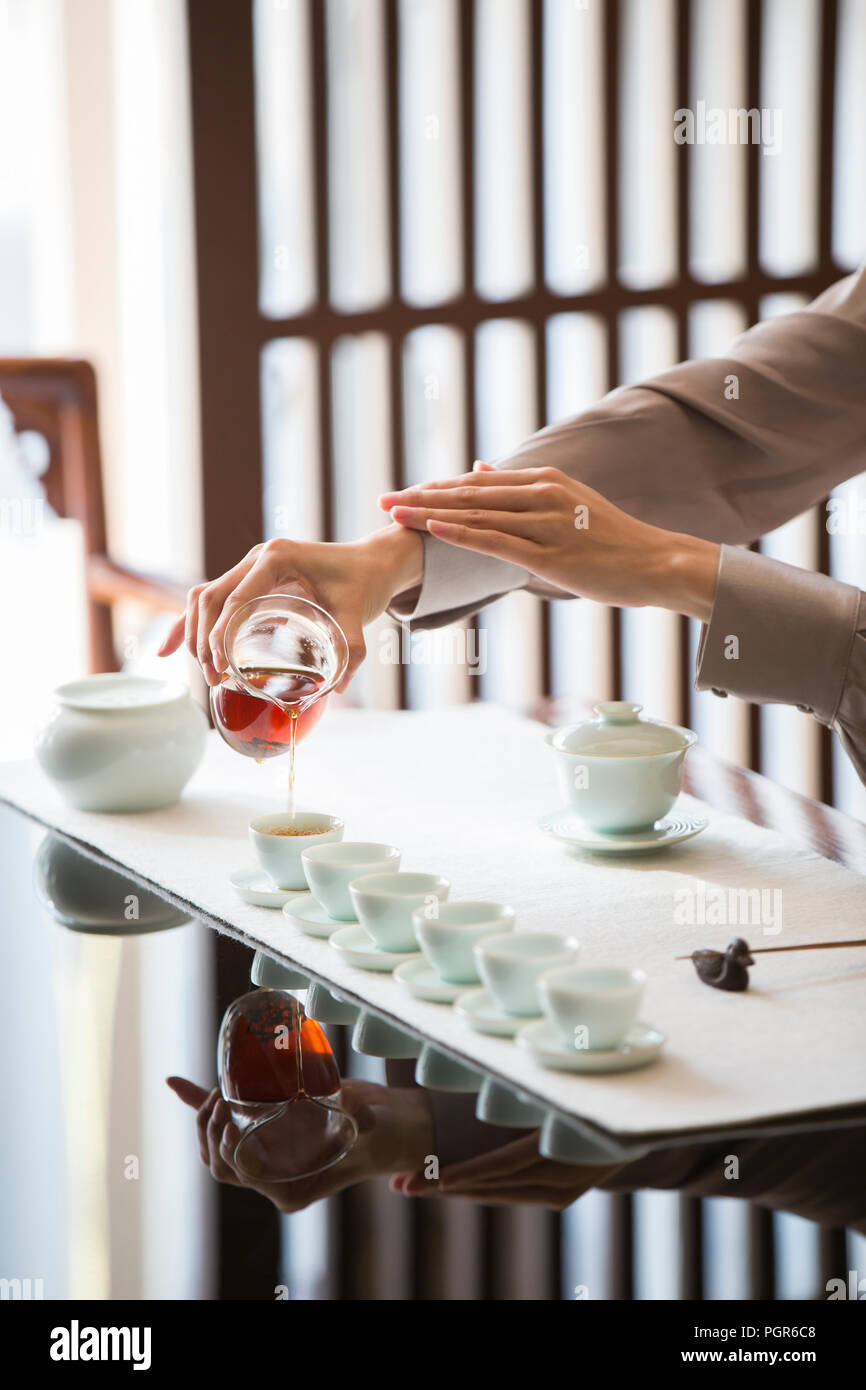 Young woman performing tea ceremony Stock Photo - Alamy