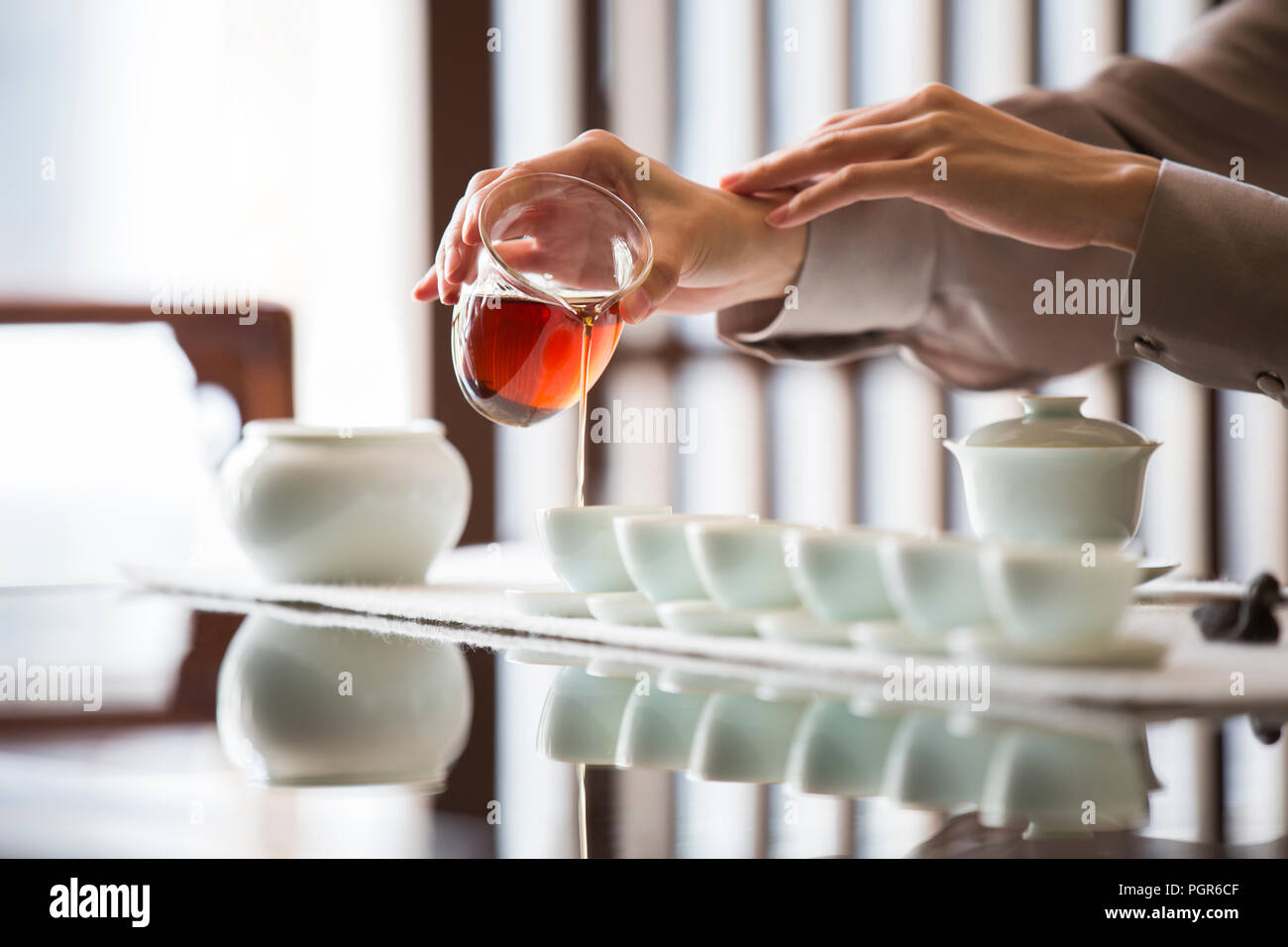 Young woman performing tea ceremony Stock Photo - Alamy