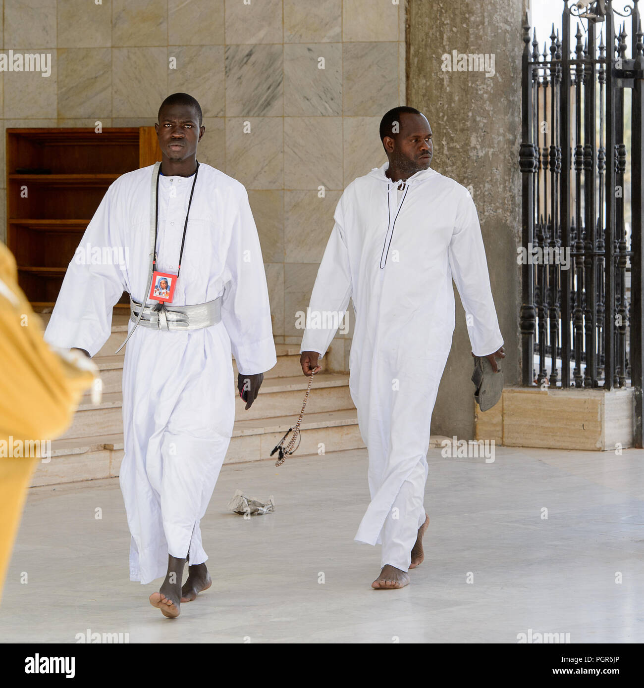 TOUBA, SENEGAL - APR 26, 2017: Unidentified Senegalese two men in white ...