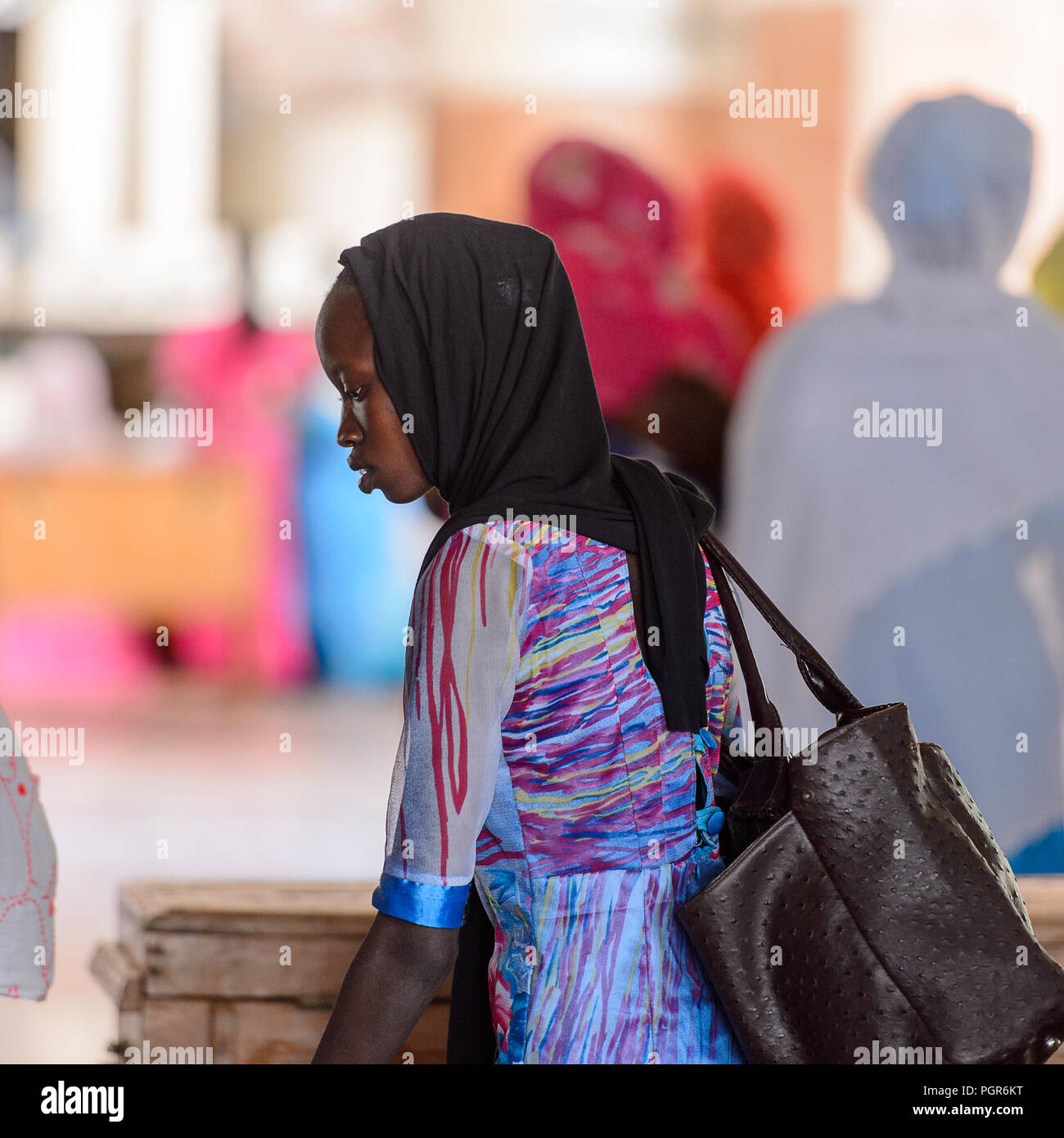 TOUBA, SENEGAL - APR 26, 2017: Unidentified Senegalese woman in colored ...