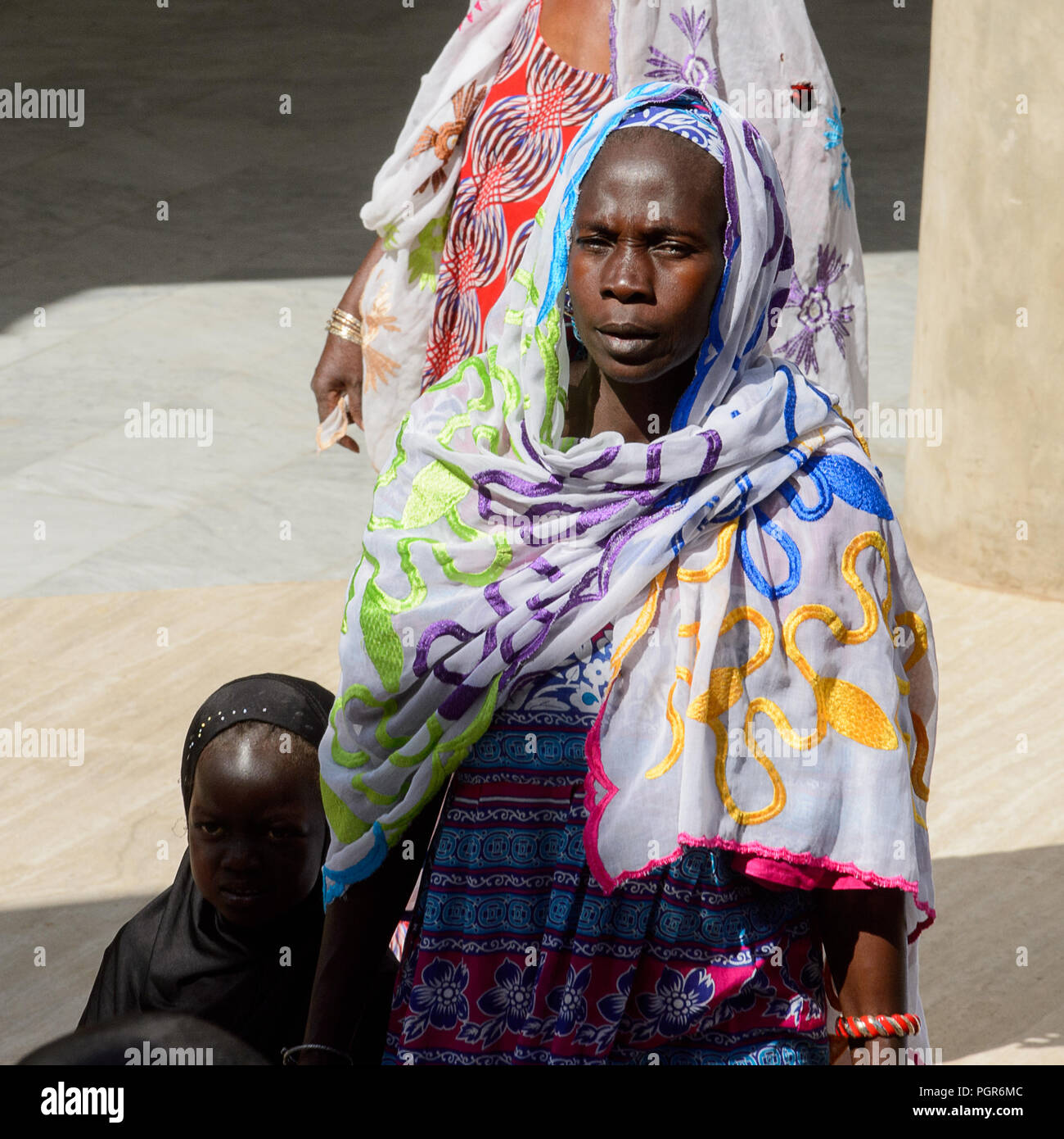 TOUBA, SENEGAL - APR 26, 2017: Unidentified Senegalese woman in colored ...