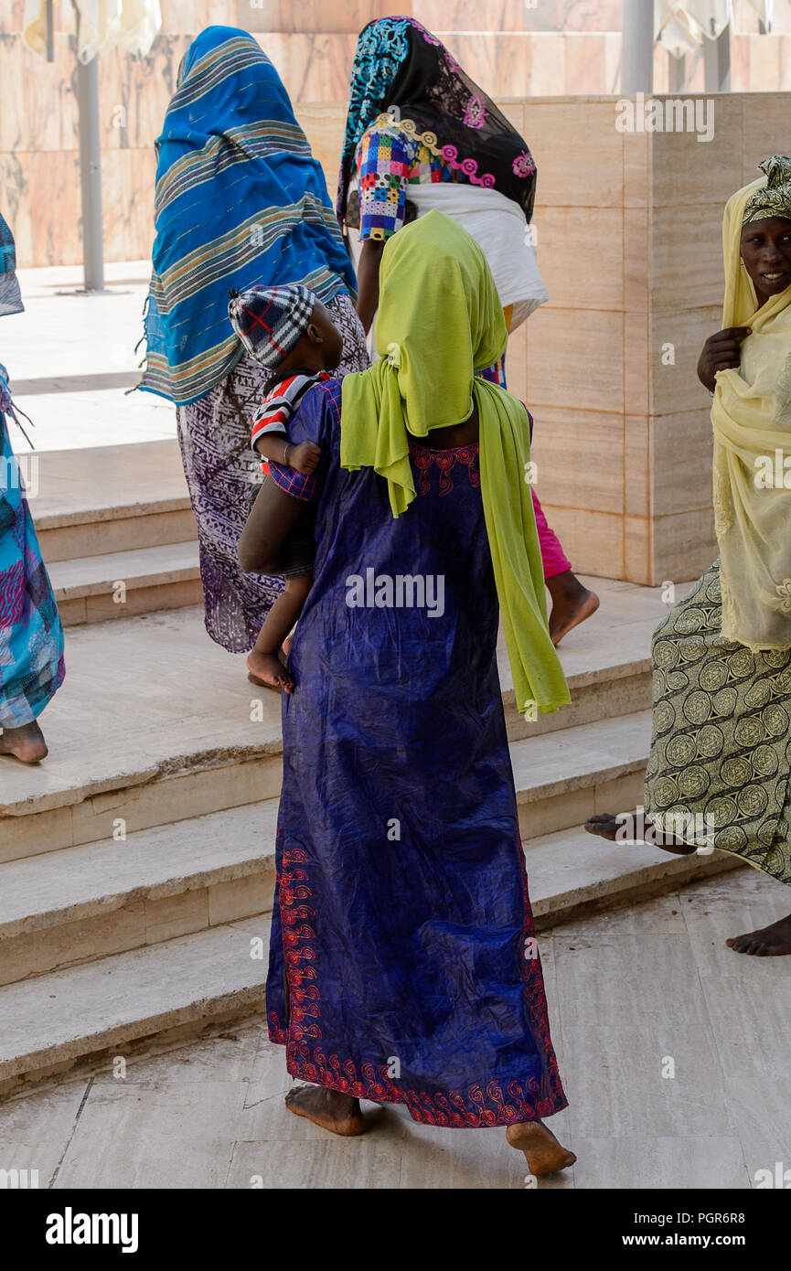 TOUBA, SENEGAL - APR 26, 2017: Unidentified Senegalese woman in colored ...