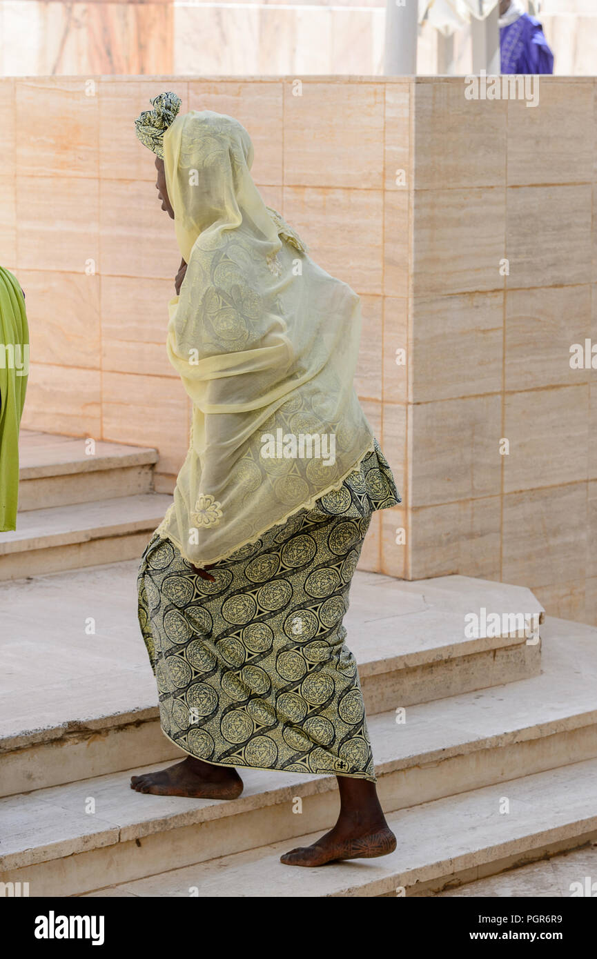 TOUBA, SENEGAL - APR 26, 2017: Unidentified Senegalese woman in colored ...