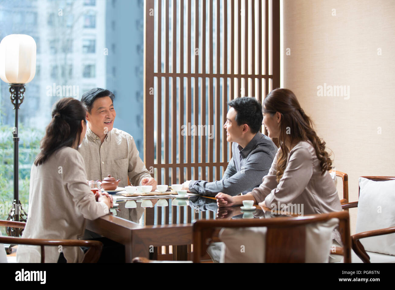 Friends drinking tea together Stock Photo - Alamy