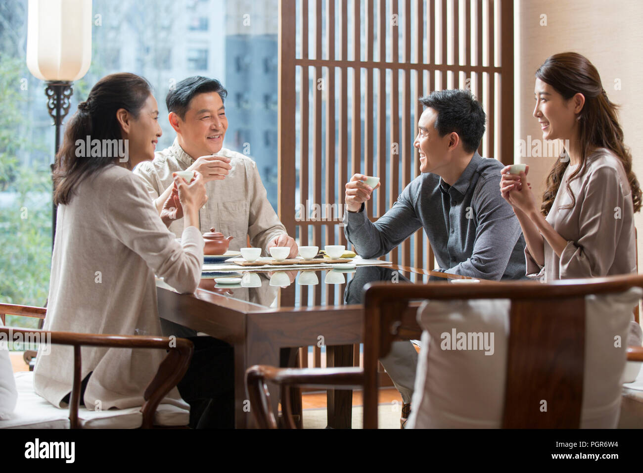 Friends drinking tea together Stock Photo - Alamy