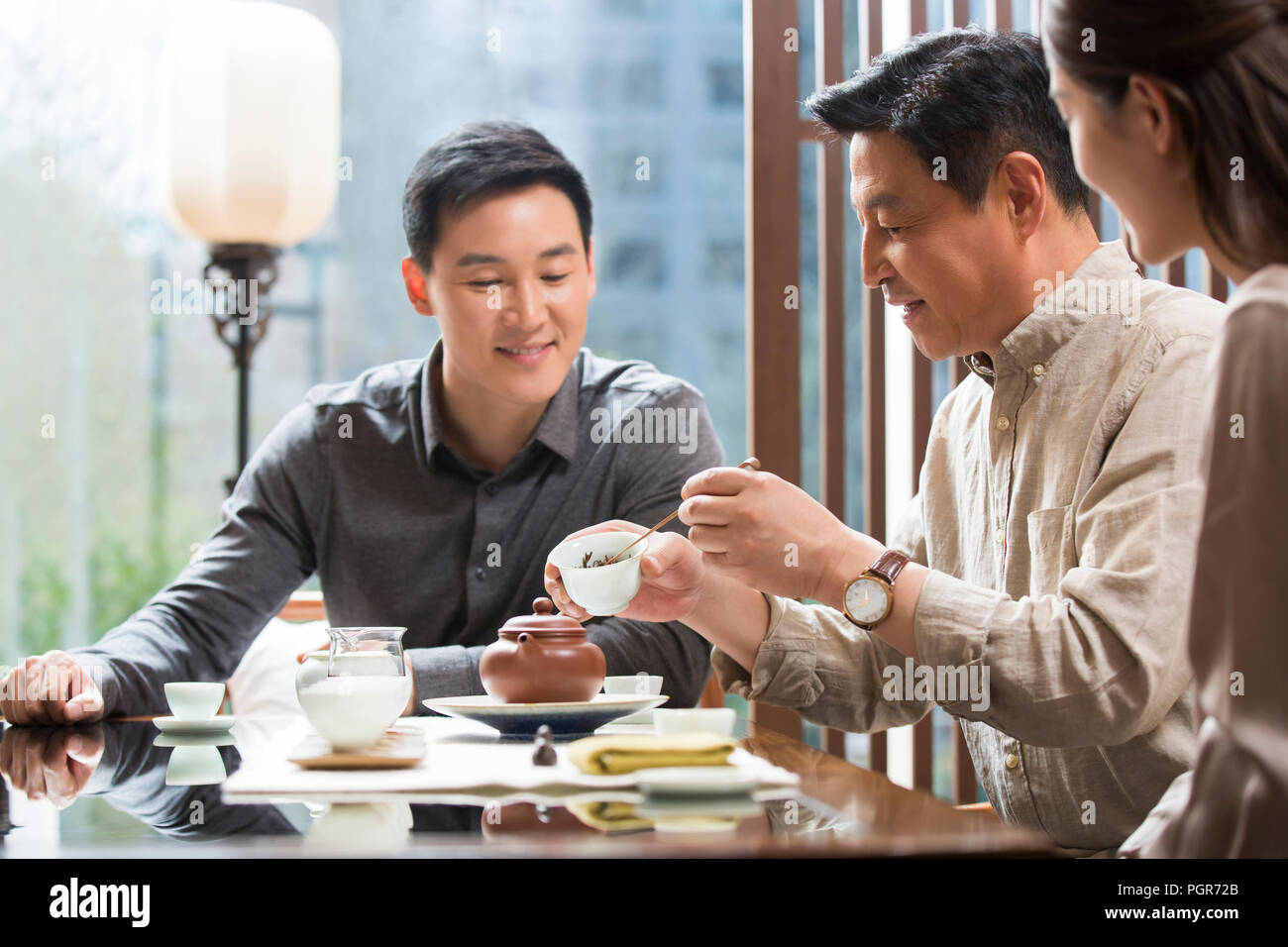 Friends drinking tea together Stock Photo - Alamy