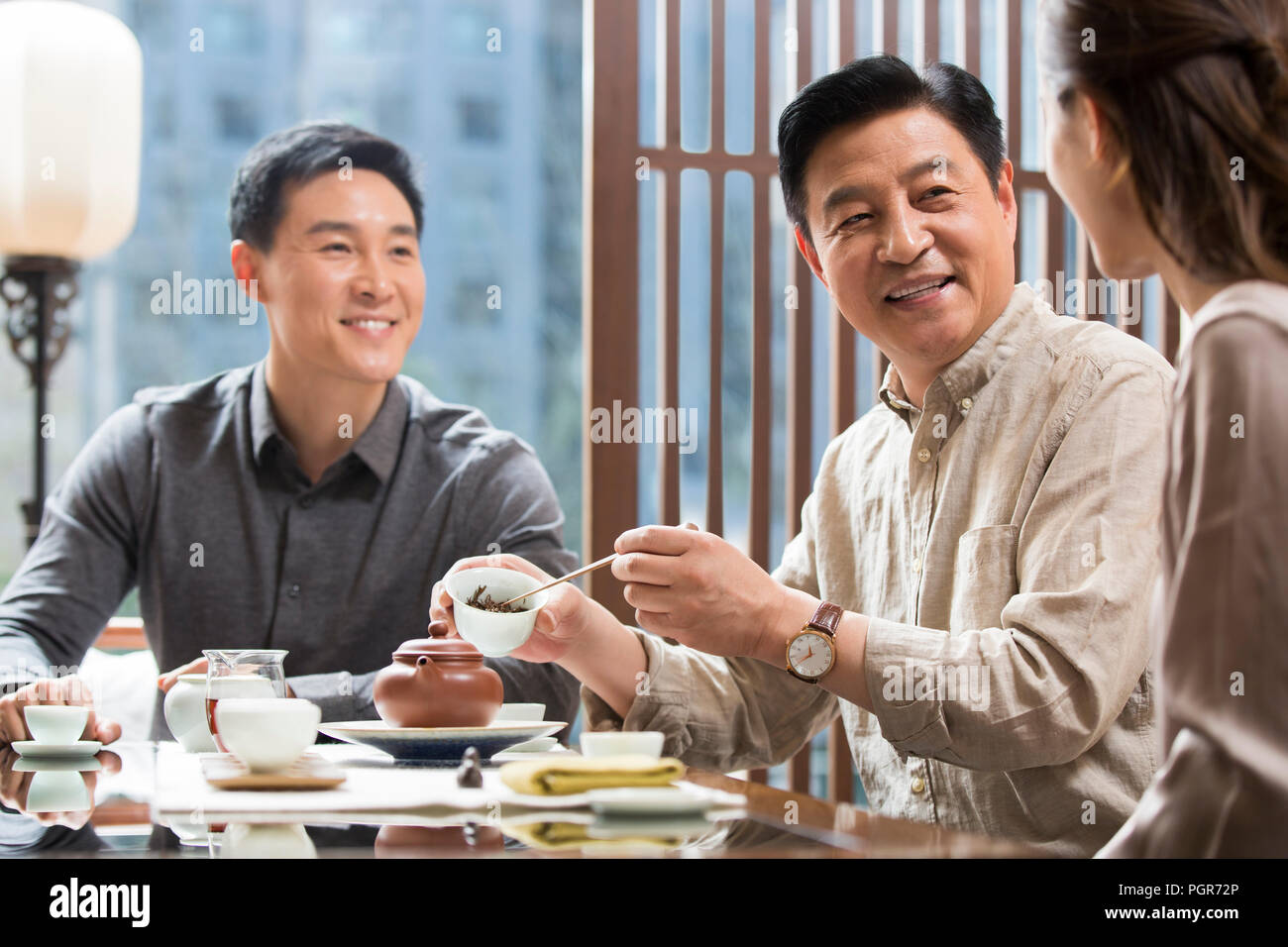 Friends drinking tea together Stock Photo - Alamy