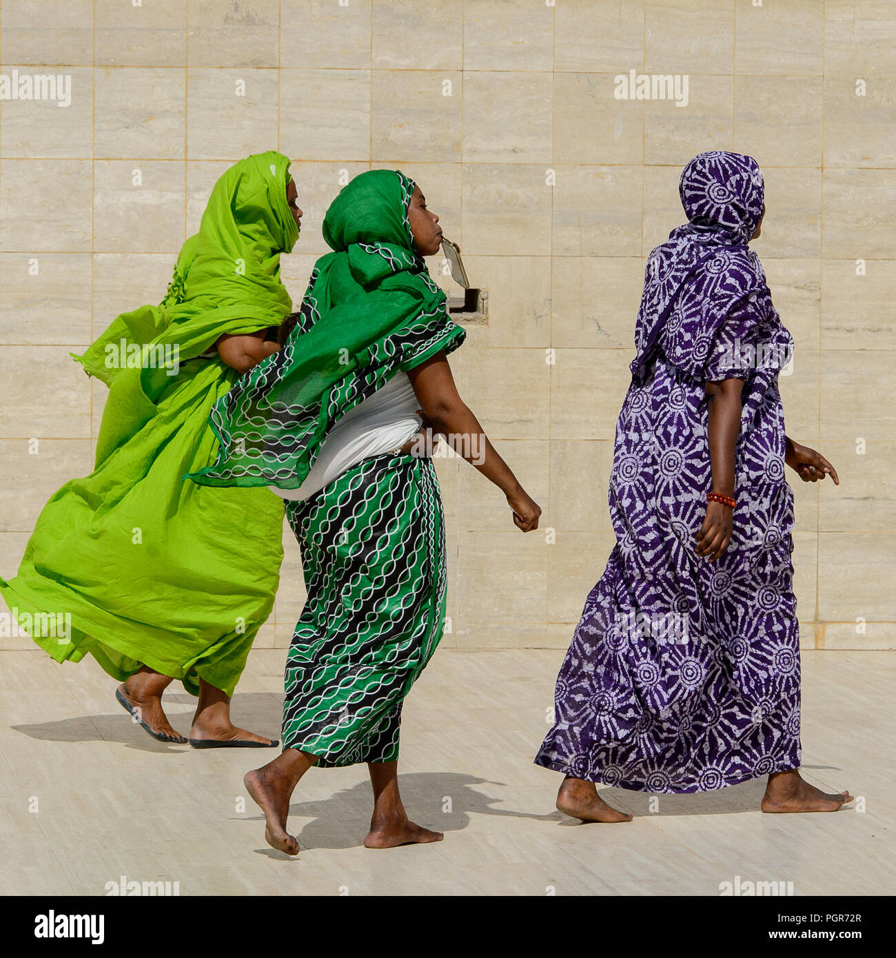 TOUBA, SENEGAL - APR 26, 2017: Unidentified Senegalese people in long ...