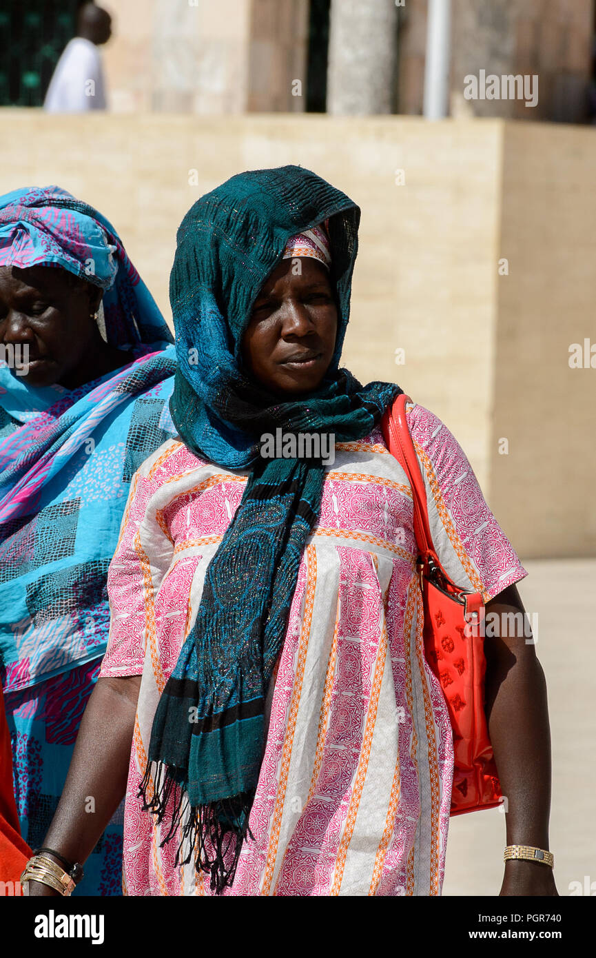TOUBA, SENEGAL - APR 26, 2017: Unidentified Senegalese woman in colored ...