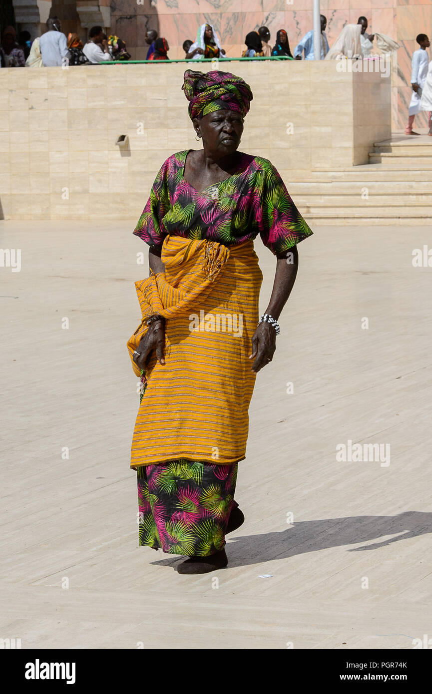 TOUBA, SENEGAL - APR 26, 2017: Unidentified Senegalese woman in colored ...