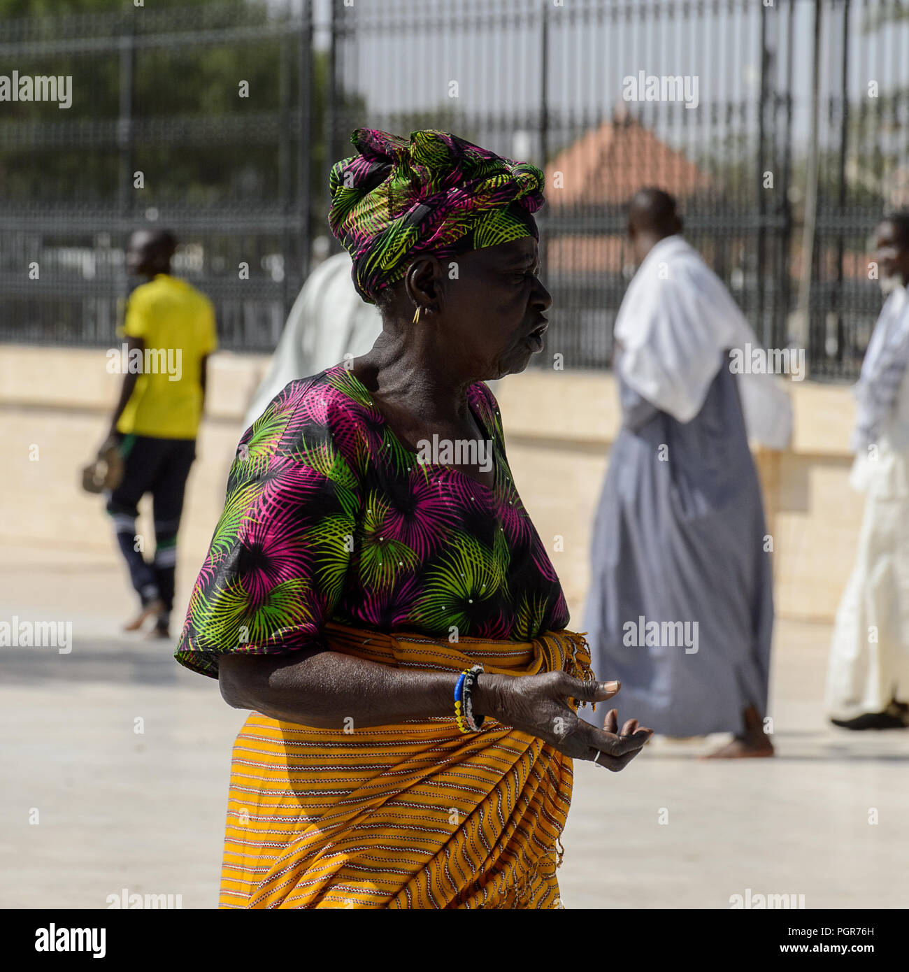 TOUBA, SENEGAL - APR 26, 2017: Unidentified Senegalese woman in colored ...