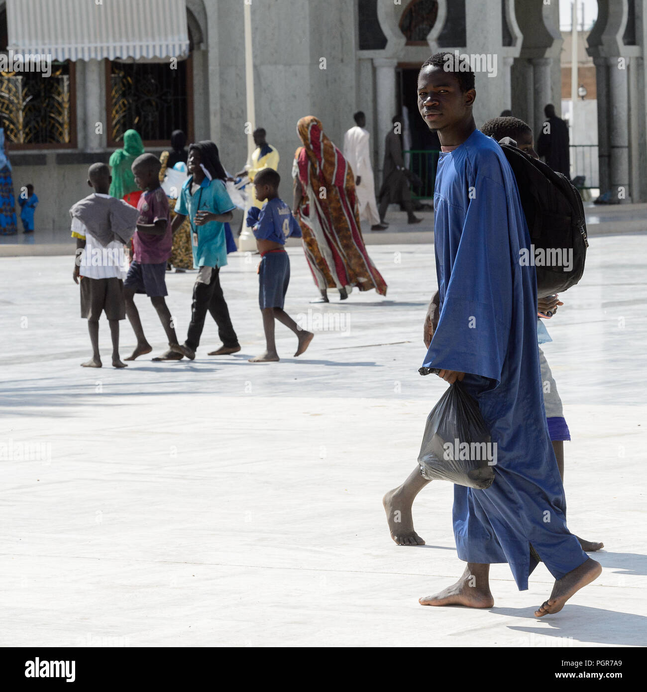 TOUBA, SENEGAL - APR 26, 2017: Unidentified Senegalese man in colored ...