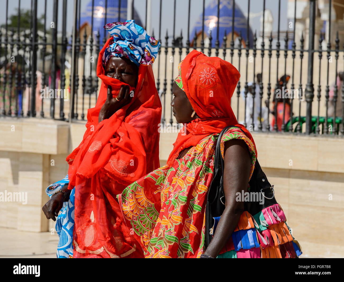TOUBA, SENEGAL - APR 26, 2017: Unidentified Senegalese woman in colored ...
