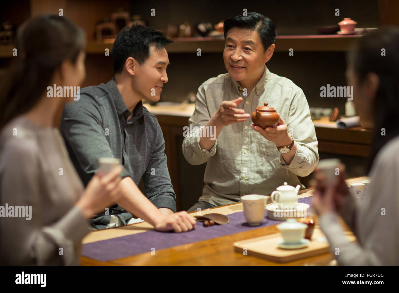 Friends drinking tea together Stock Photo - Alamy