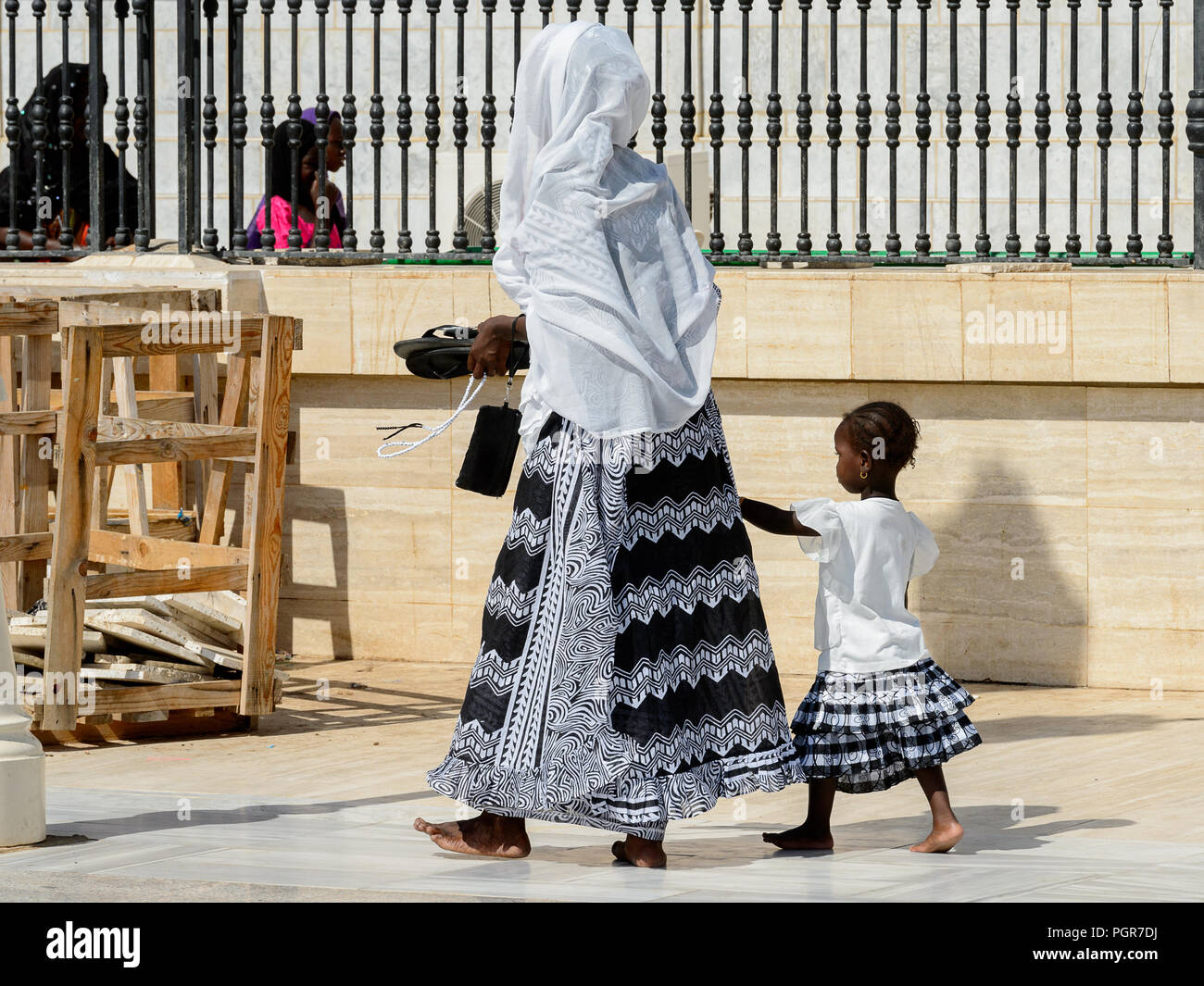 TOUBA, SENEGAL - APR 26, 2017: Unidentified Senegalese woman in colored ...