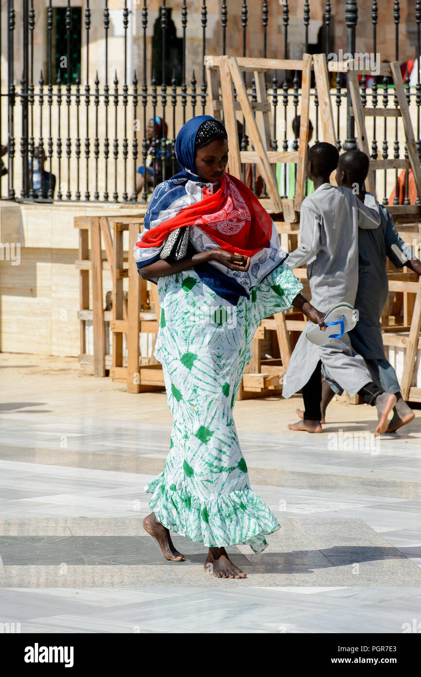 TOUBA, SENEGAL - APR 26, 2017: Unidentified Senegalese woman in colored ...