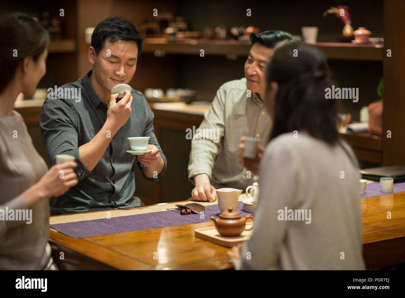 Friends drinking tea together Stock Photo - Alamy