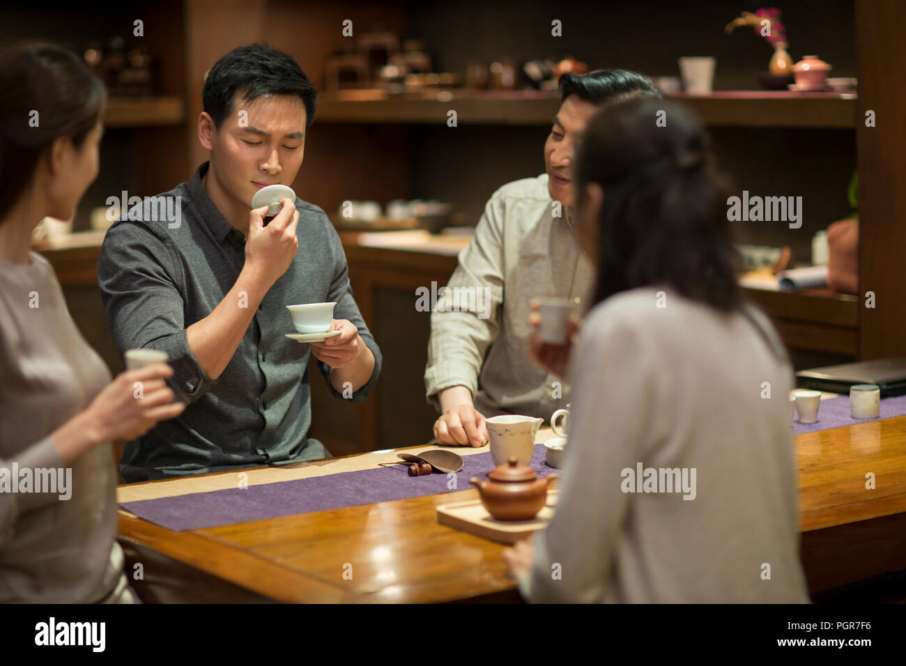 Friends drinking tea together Stock Photo - Alamy