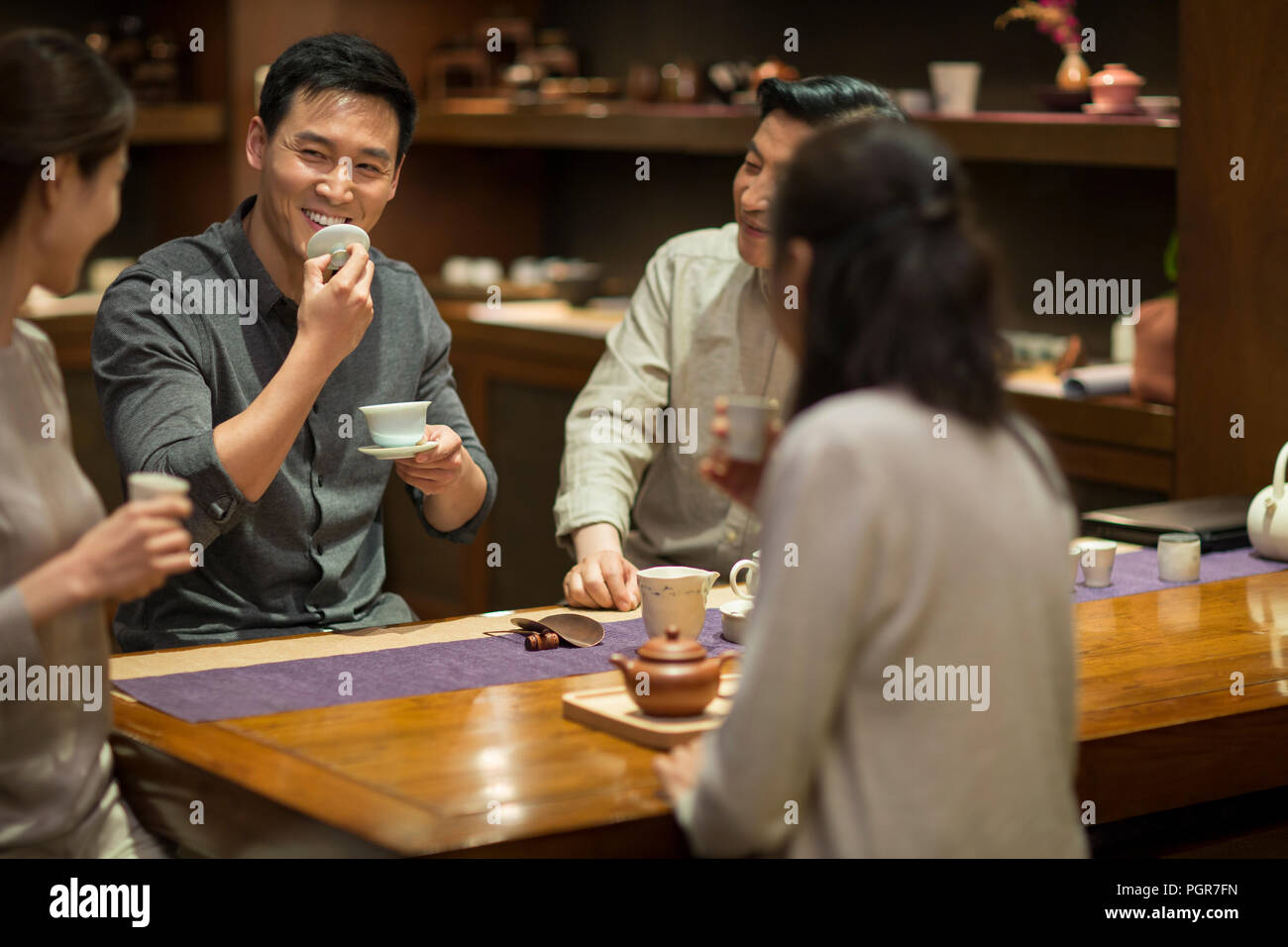 Friends drinking tea together Stock Photo - Alamy