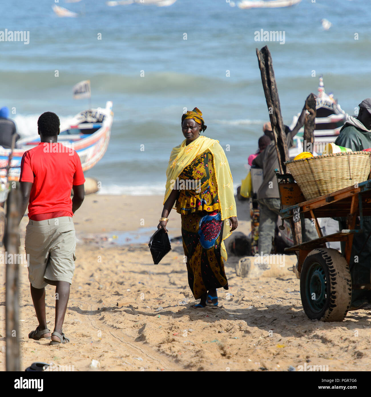 KAYAR, SENEGAL - APR 27, 2017: Unidentified Senegalese people walk on ...