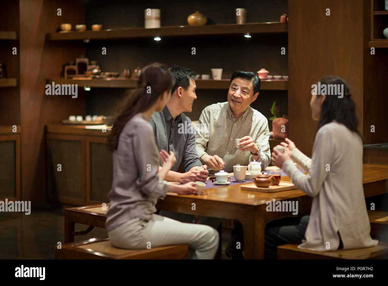 Friends drinking tea together Stock Photo - Alamy