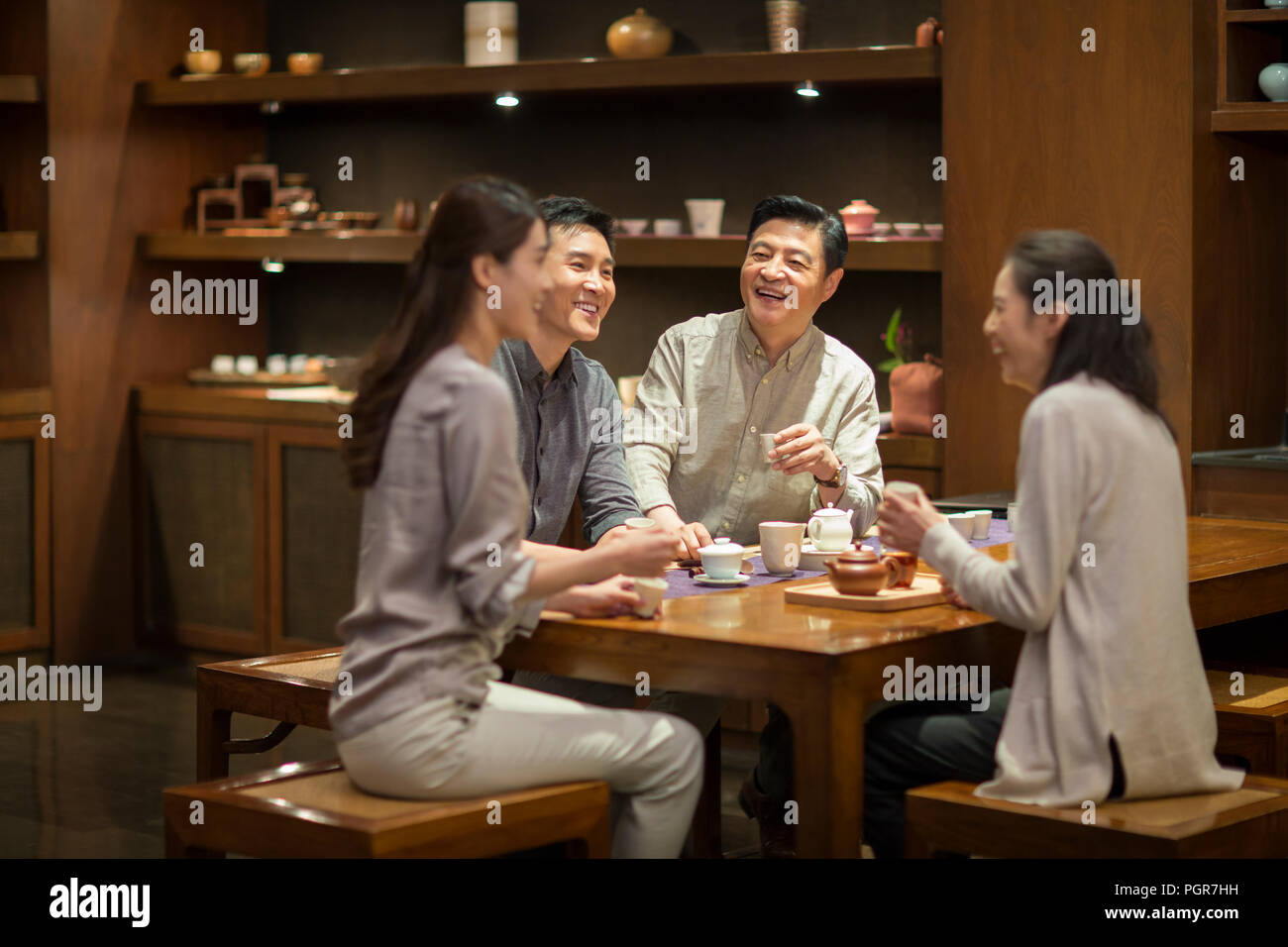Friends drinking tea together Stock Photo - Alamy