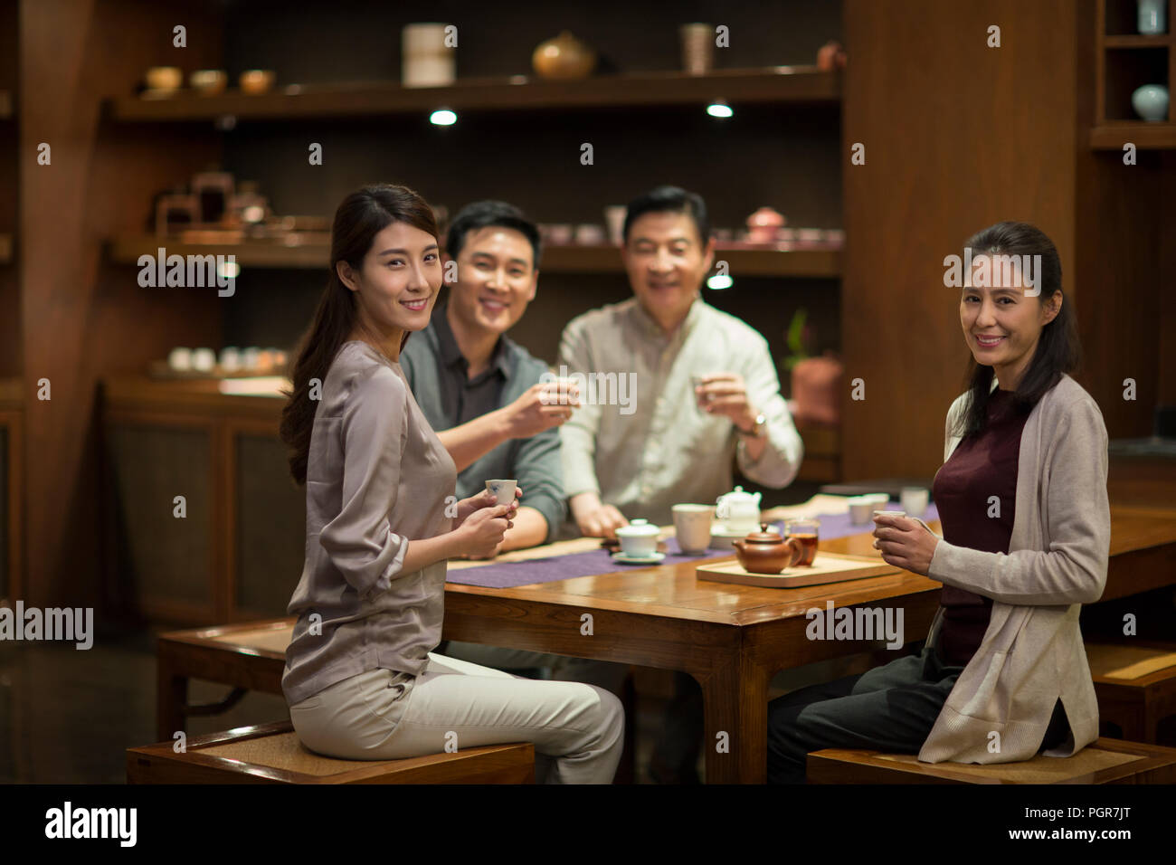 Friends drinking tea together Stock Photo - Alamy