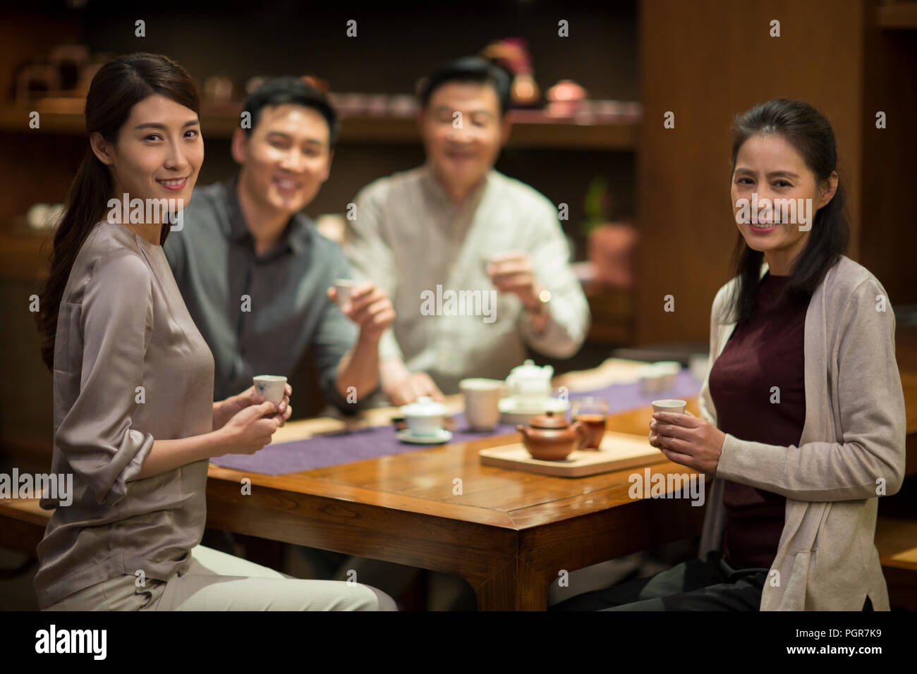 Friends drinking tea together Stock Photo - Alamy