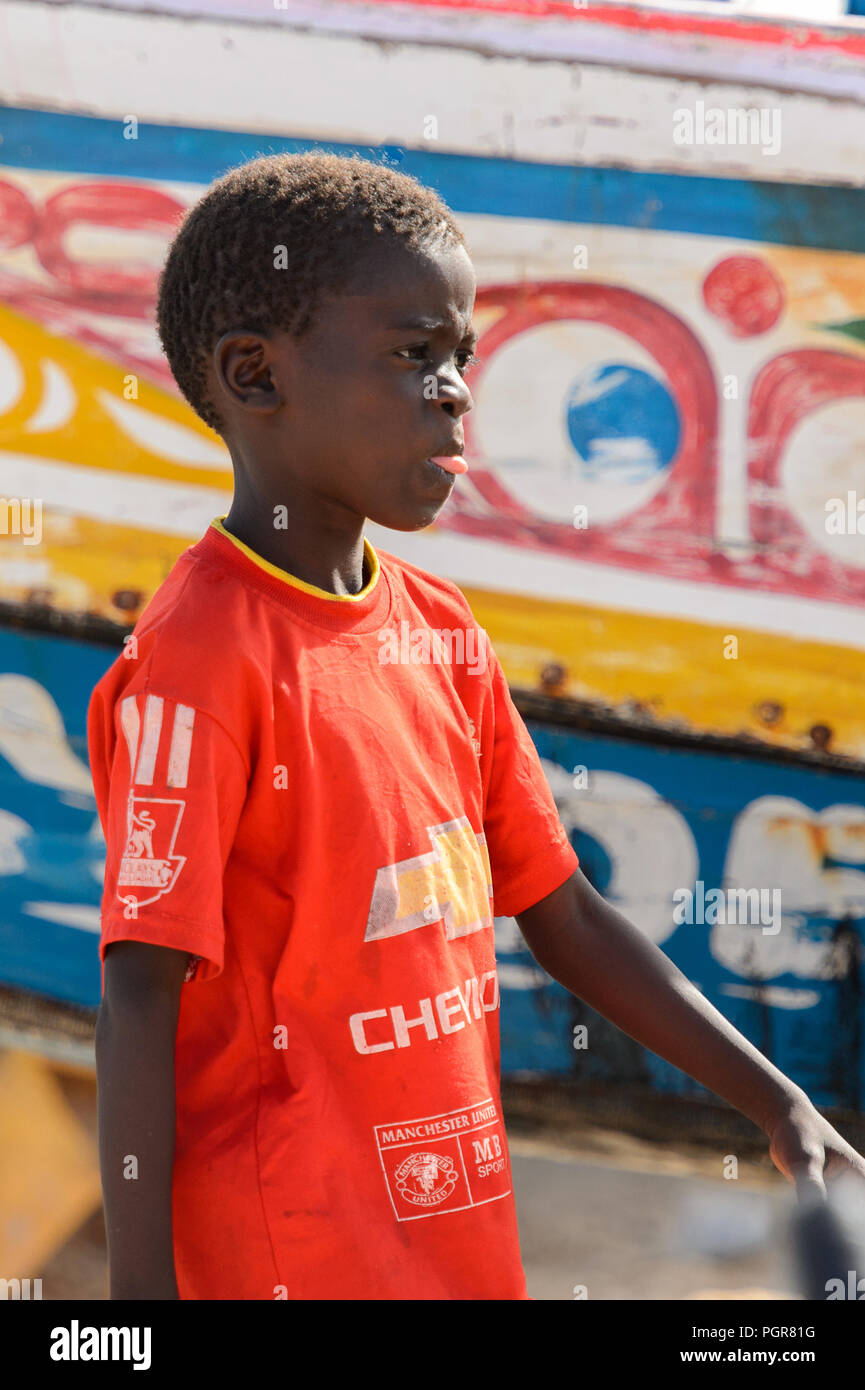 KAYAR, SENEGAL - APR 27, 2017: Unidentified Senegalese little boy walks ...
