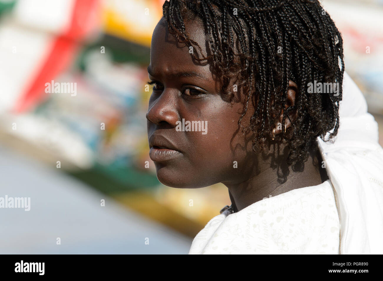 KAYAR, SENEGAL - APR 27, 2017: Unidentified Senegalese girl with braids ...