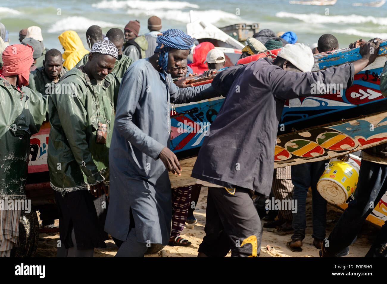 KAYAR, SENEGAL - APR 27, 2017: Unidentified Senegalese people pull the ...