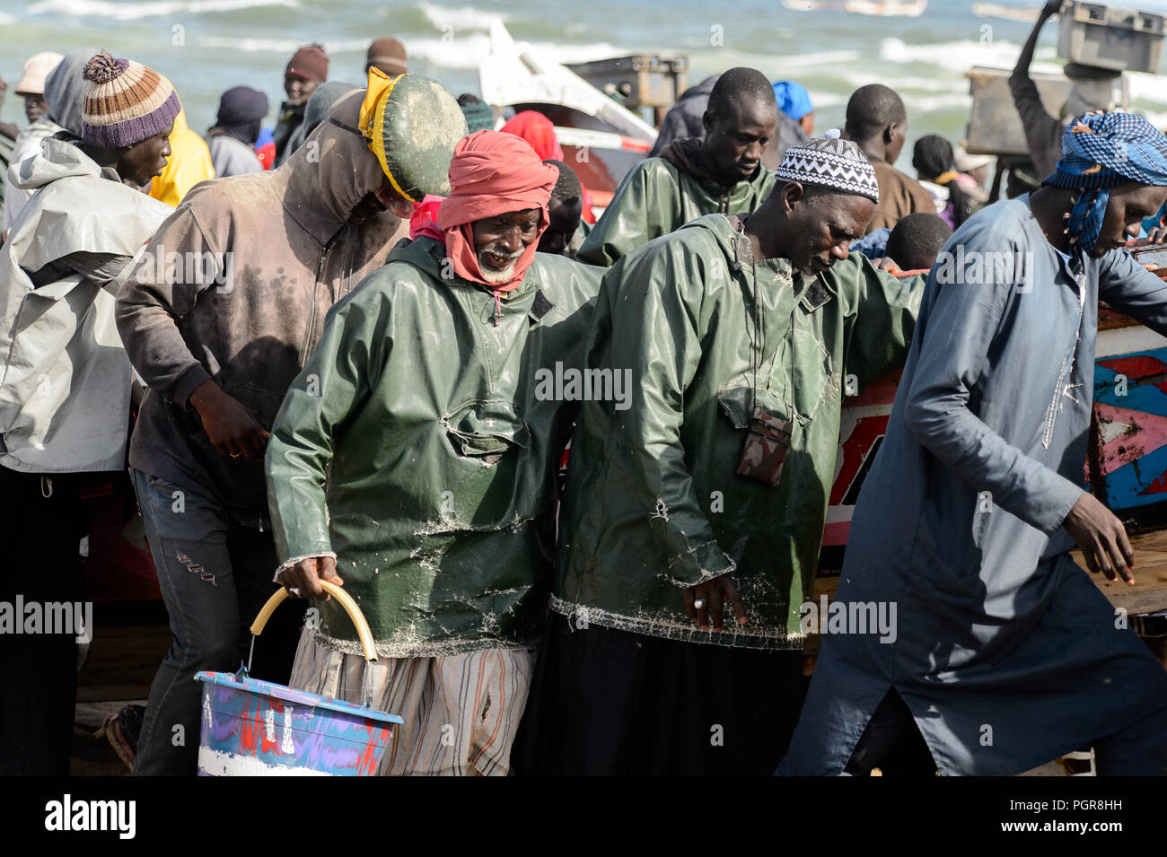 KAYAR, SENEGAL - APR 27, 2017: Unidentified Senegalese people pull the ...