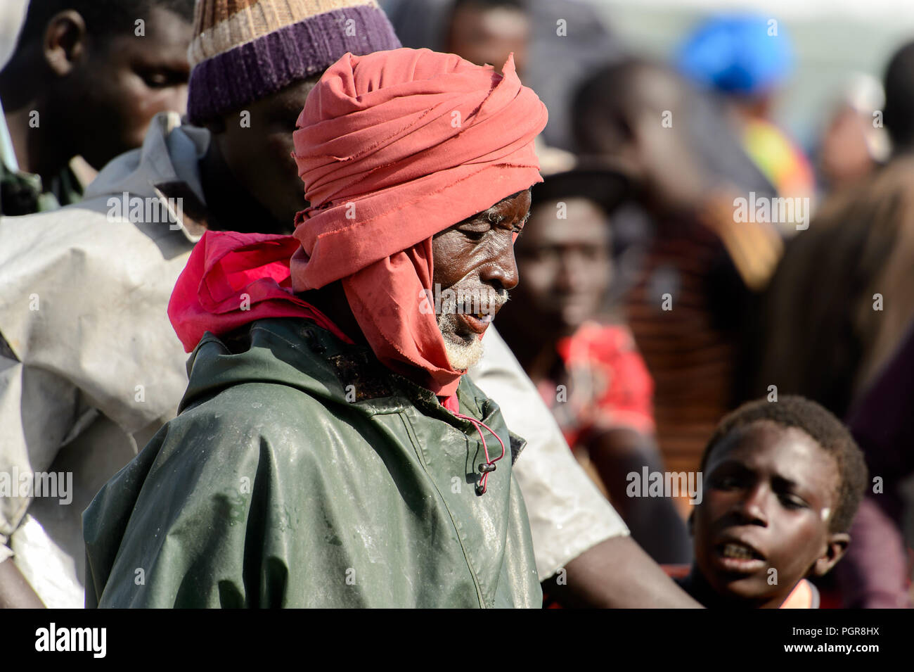 KAYAR, SENEGAL - APR 27, 2017: Unidentified Senegalese man in red ...