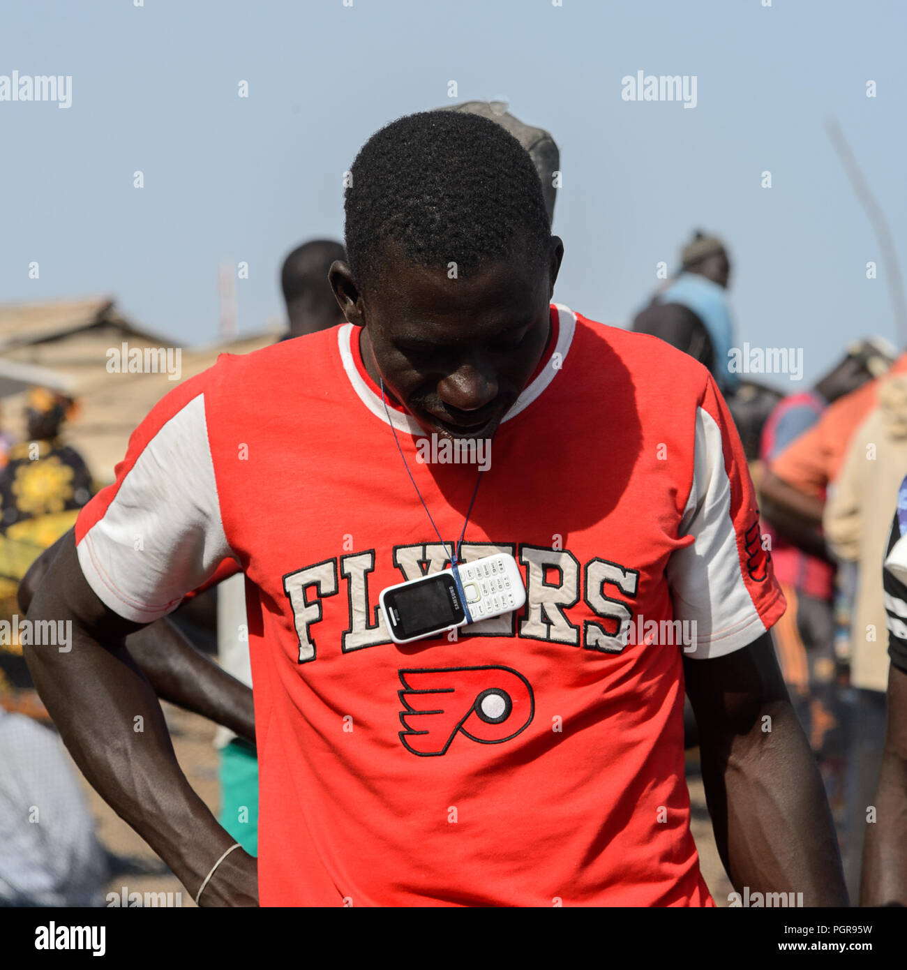 KAYAR, SENEGAL - APR 27, 2017: Unidentified Senegalese man looks down ...