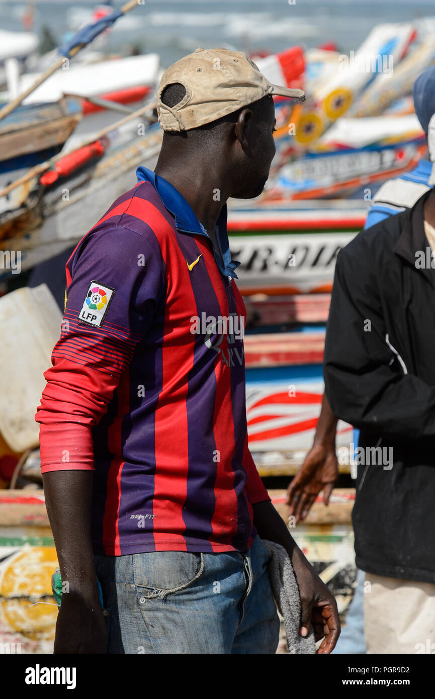 KAYAR, SENEGAL - APR 27, 2017: Unidentified Senegalese man walks on the ...