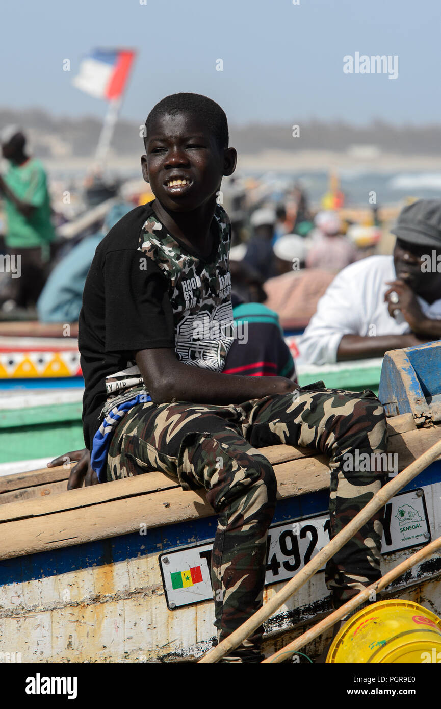 KAYAR, SENEGAL - APR 27, 2017: Unidentified Senegalese little boy sits ...