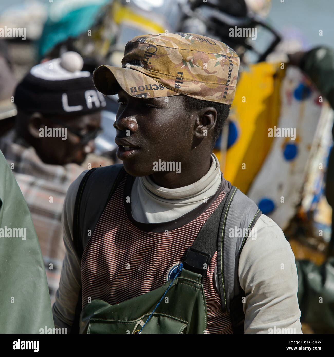 KAYAR, SENEGAL - APR 27, 2017: Unidentified Senegalese man in a cap ...