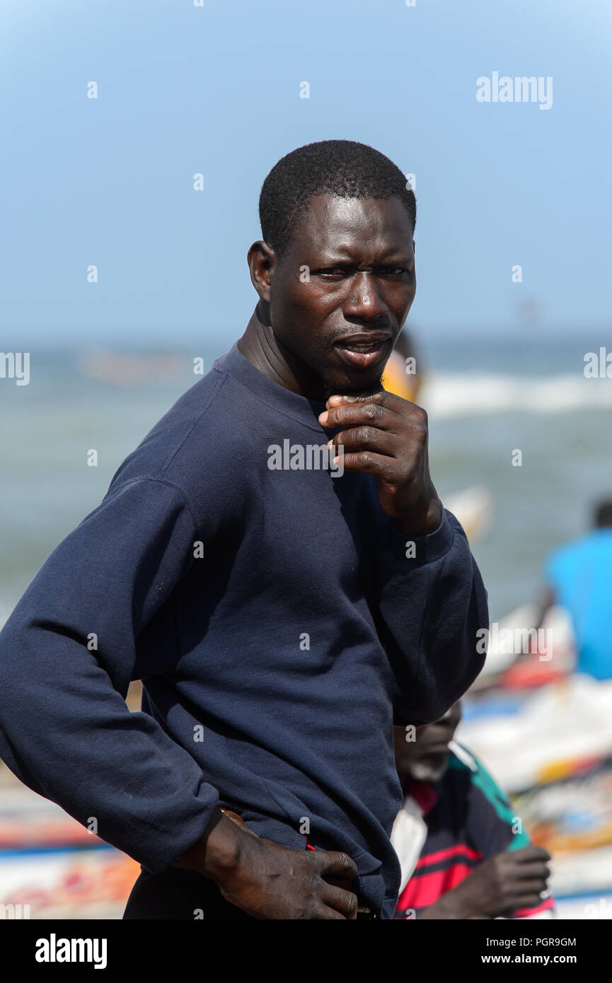KAYAR, SENEGAL - APR 27, 2017: Unidentified Senegalese man looks ahead ...