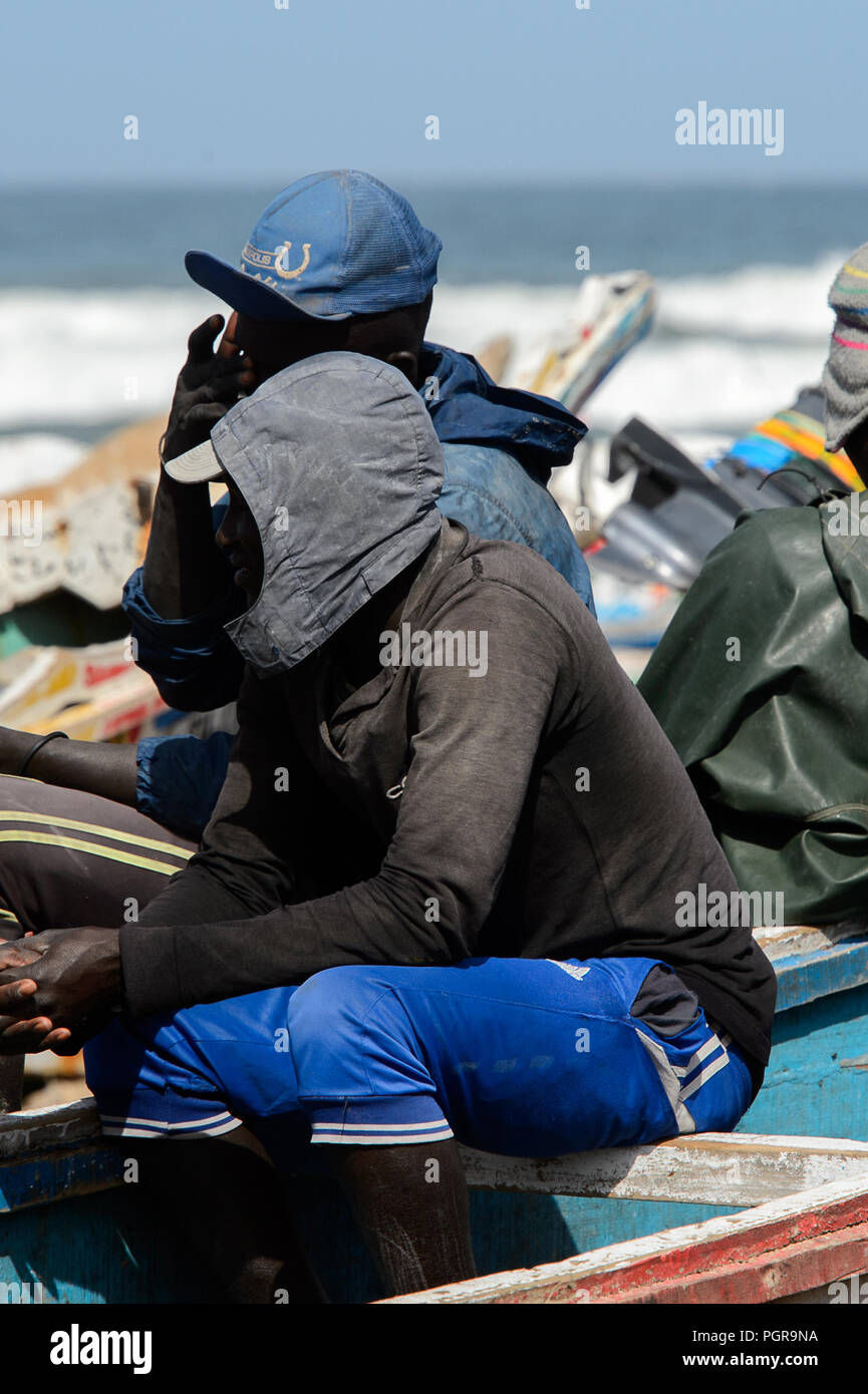 KAYAR, SENEGAL - APR 27, 2017: Unidentified Senegalese man sits on the ...