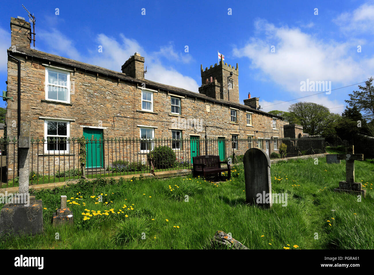 Stone cottages and St Oswald's Church, Askrigg village, Richmondshire ...