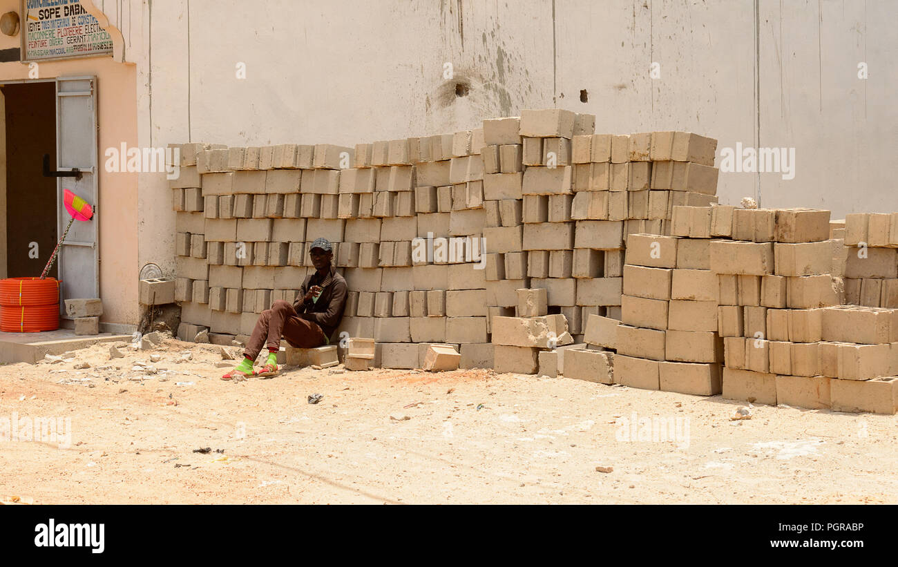 LAC ROSE reg., SENEGAL - APR 27, 2017: Unidentified Senegalese man sits ...