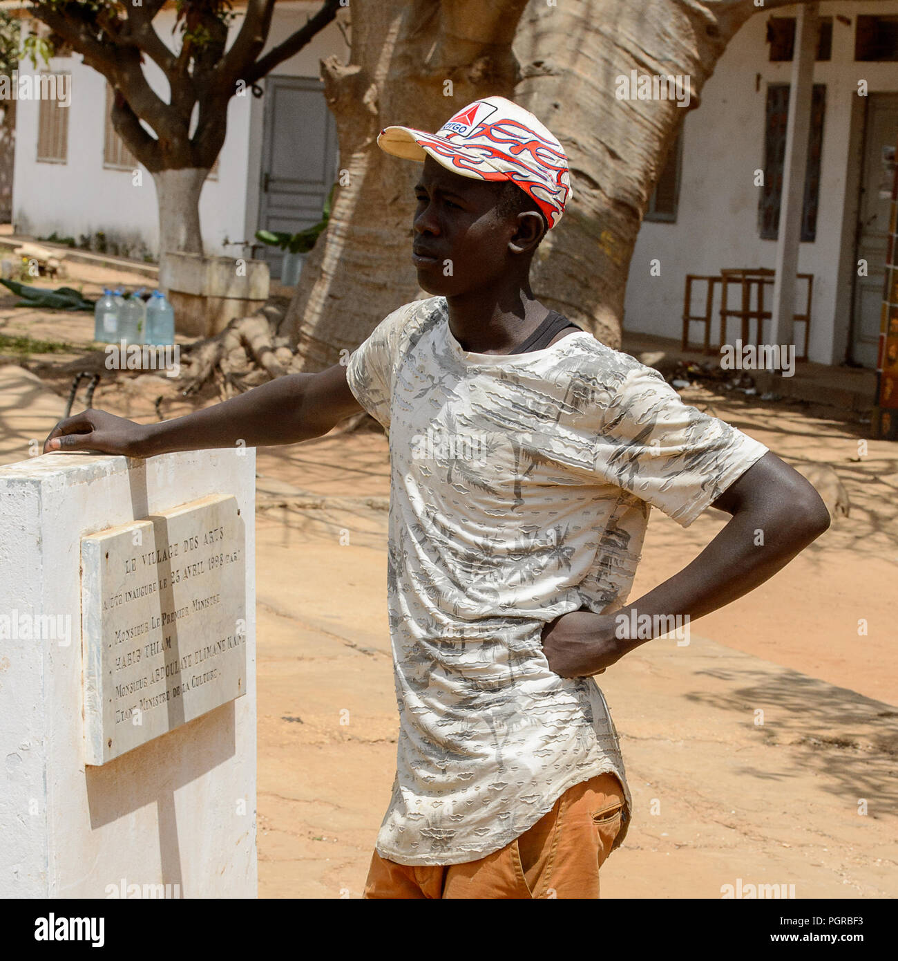 DAKAR, SENEGAL - APR 27, 2017: Unidentified Senegalese man puts his ...